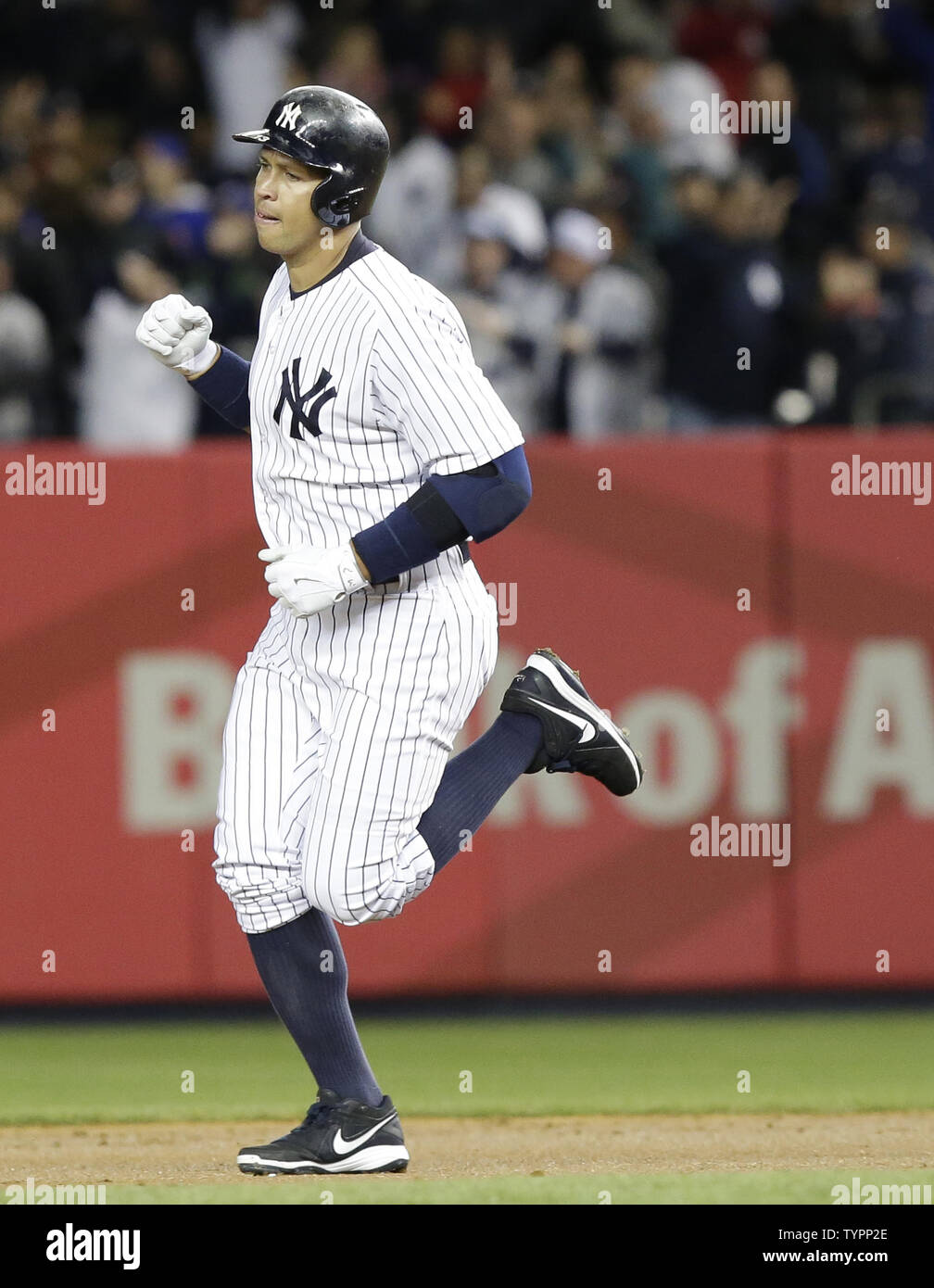 New York Yankees Alex Rodriguez pumps his fist as he runs the bases ...