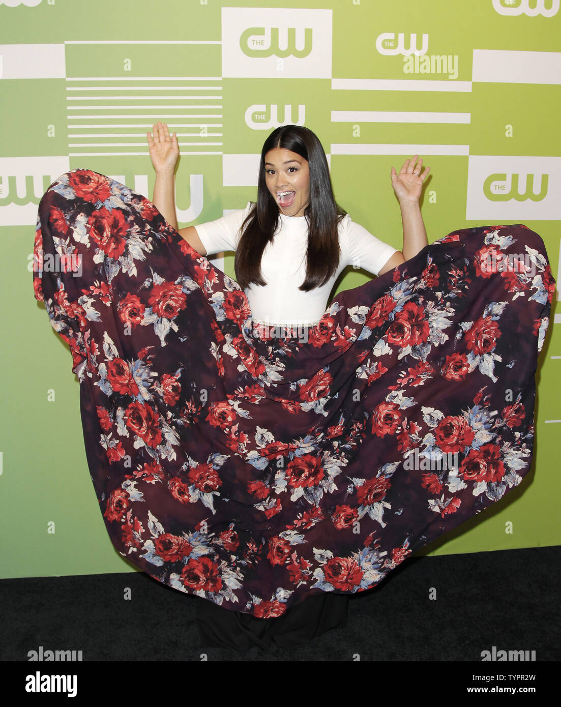 Gina Rodriguez arrives on the red carpet at the CW Network's New York ...