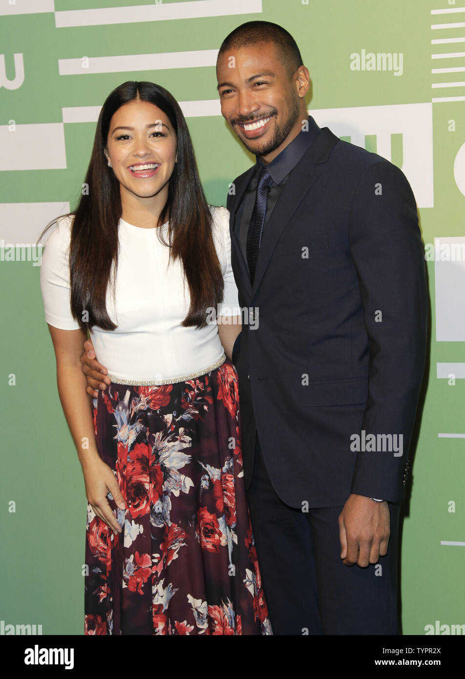 Gina Rodriguez arrives on the red carpet at the CW Network's New York ...