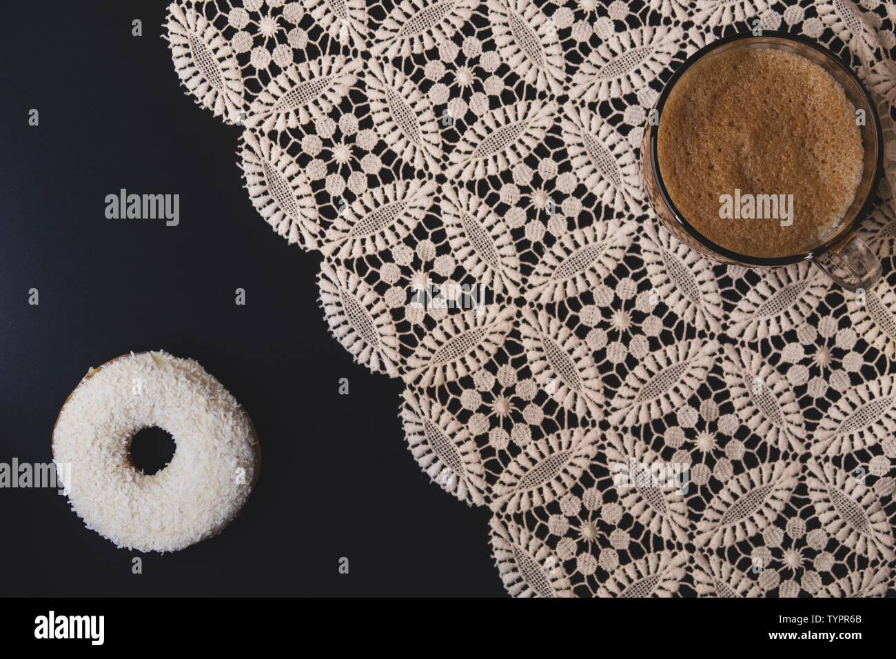 Flat lay with black background with coffee mug and donut Stock Photo ...