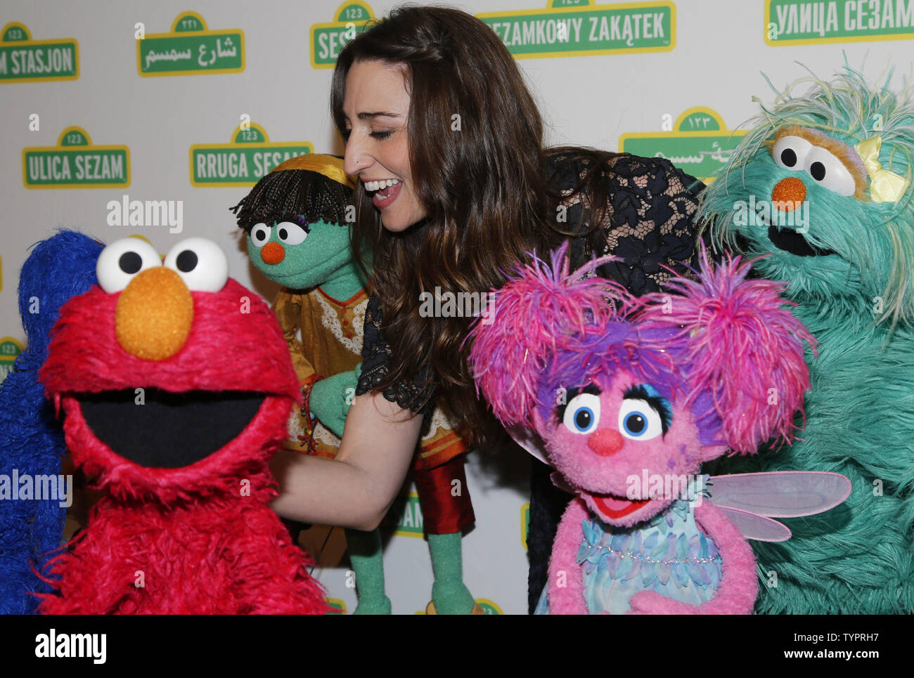 Sara Bareilles stands on the red carpet with Elmo and other Sesame ...