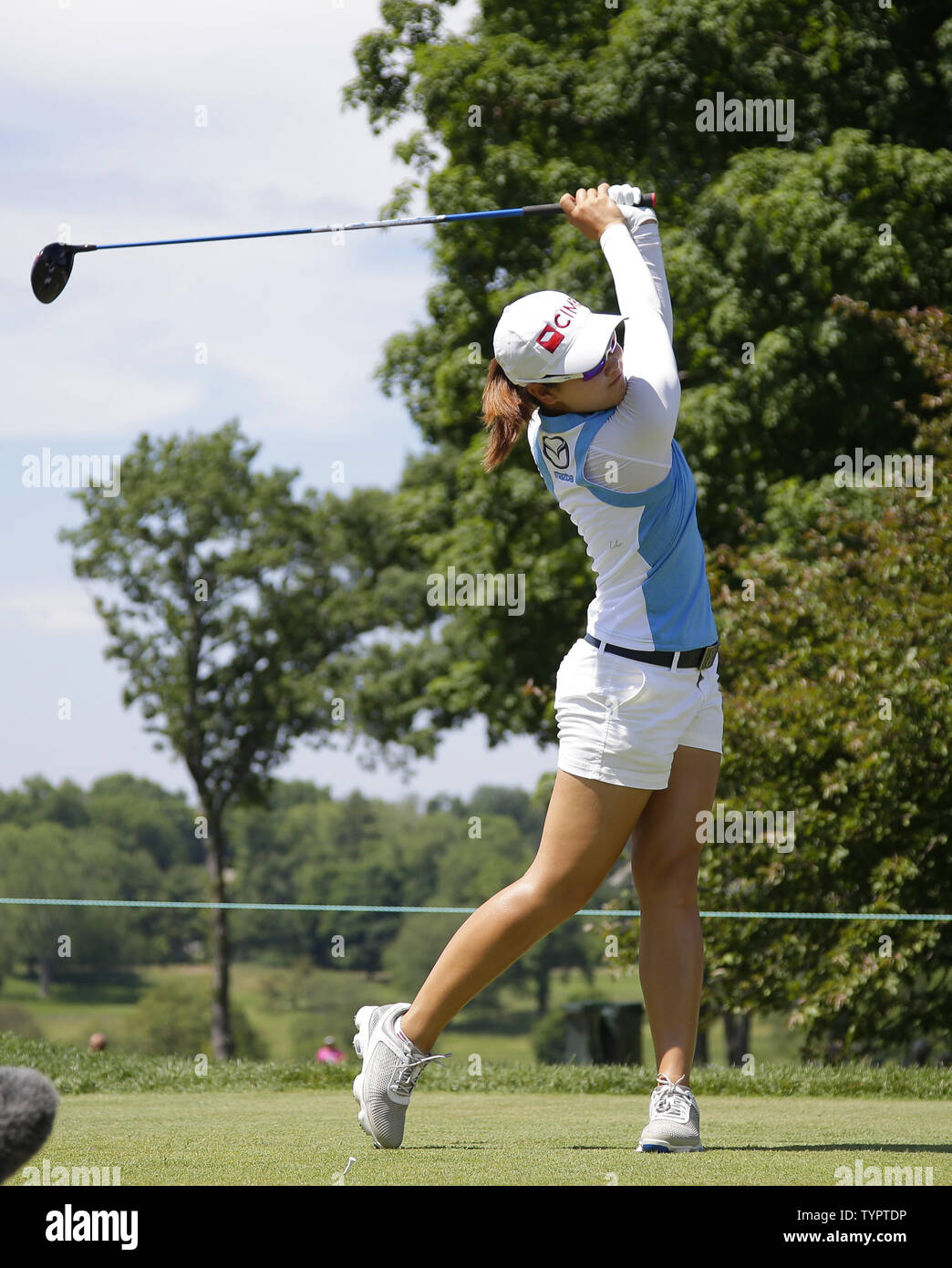 Kelly Tan of Malasia hits her tee shot on the 11th hole in the final ...