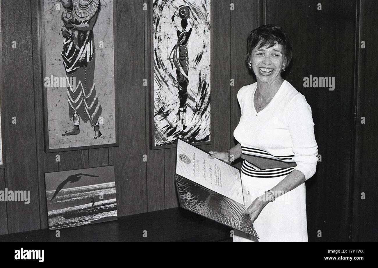 WOMAN HOLDING CERTIFICATE. 8-16-78 JIM SCHILL Stock Photo - Alamy