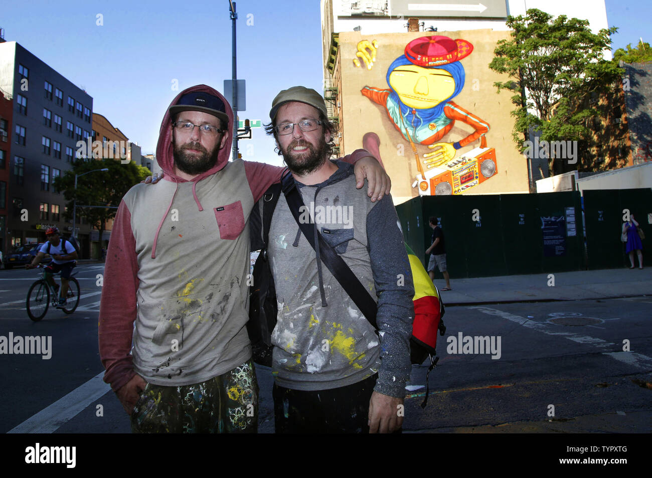 Brazilian twins and street artists 'Os Gemeos' pose for a picture in ...