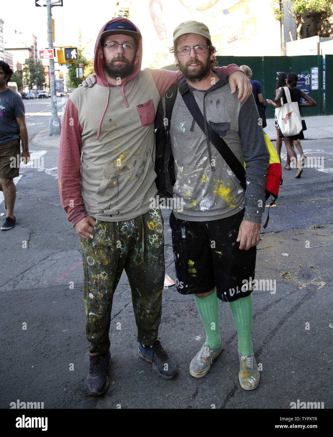 Brazilian twins and street artists 'Os Gemeos' pose for a picture in ...