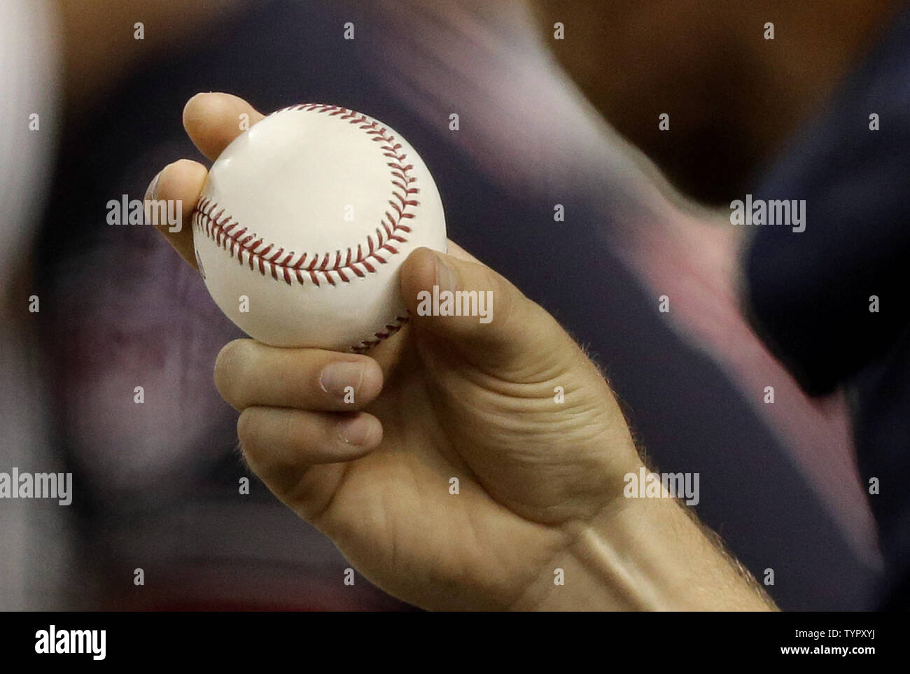 Cleveland Indians pitcher Cody Anderson holds a baseball in the dugout ...