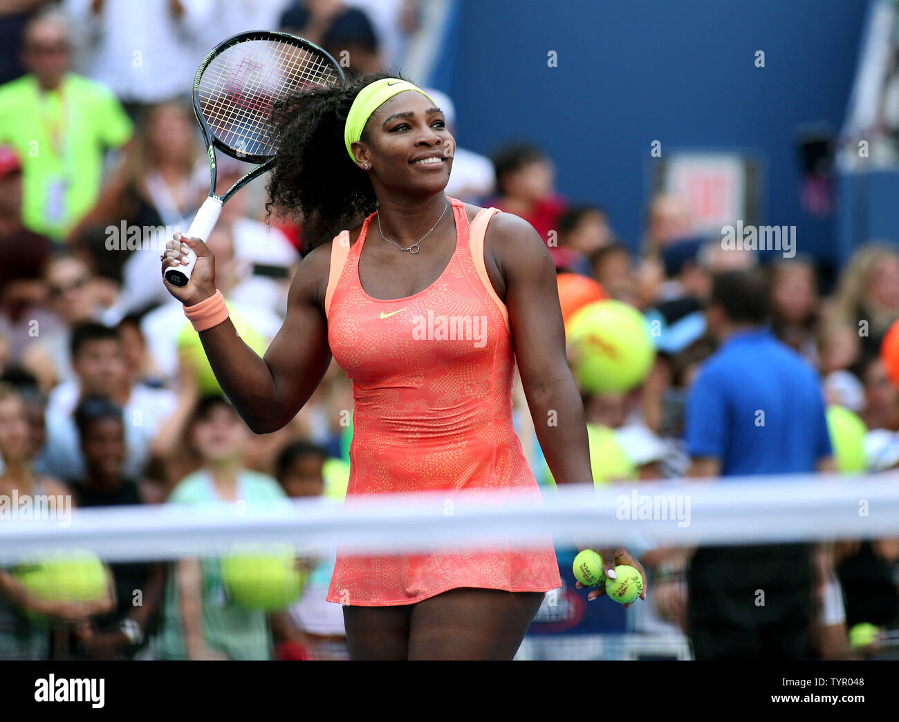 Serena Williams of the USA gets ready to hit balls into the stands for ...