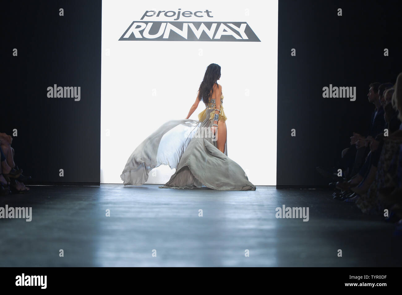 A model walks on the runway at the Project Runway finale at IMG New ...