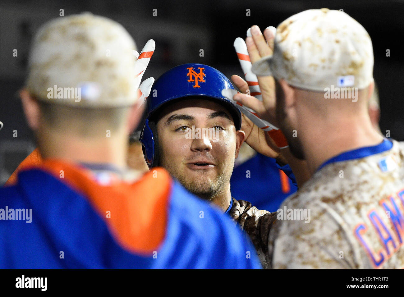 New York Mets left fielder Michael Conforto (30) is greeted in the ...