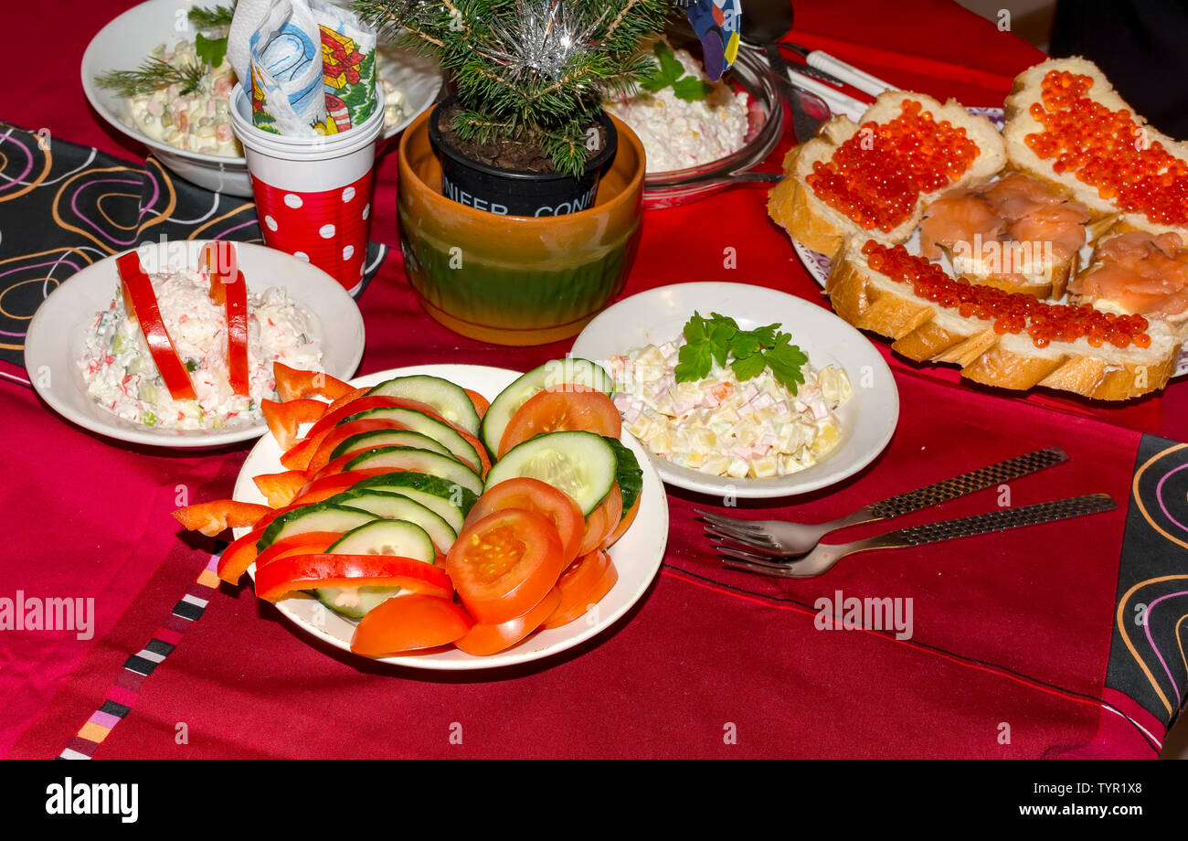 Dinner with sandwiches with red caviar and salted fish Stock Photo - Alamy