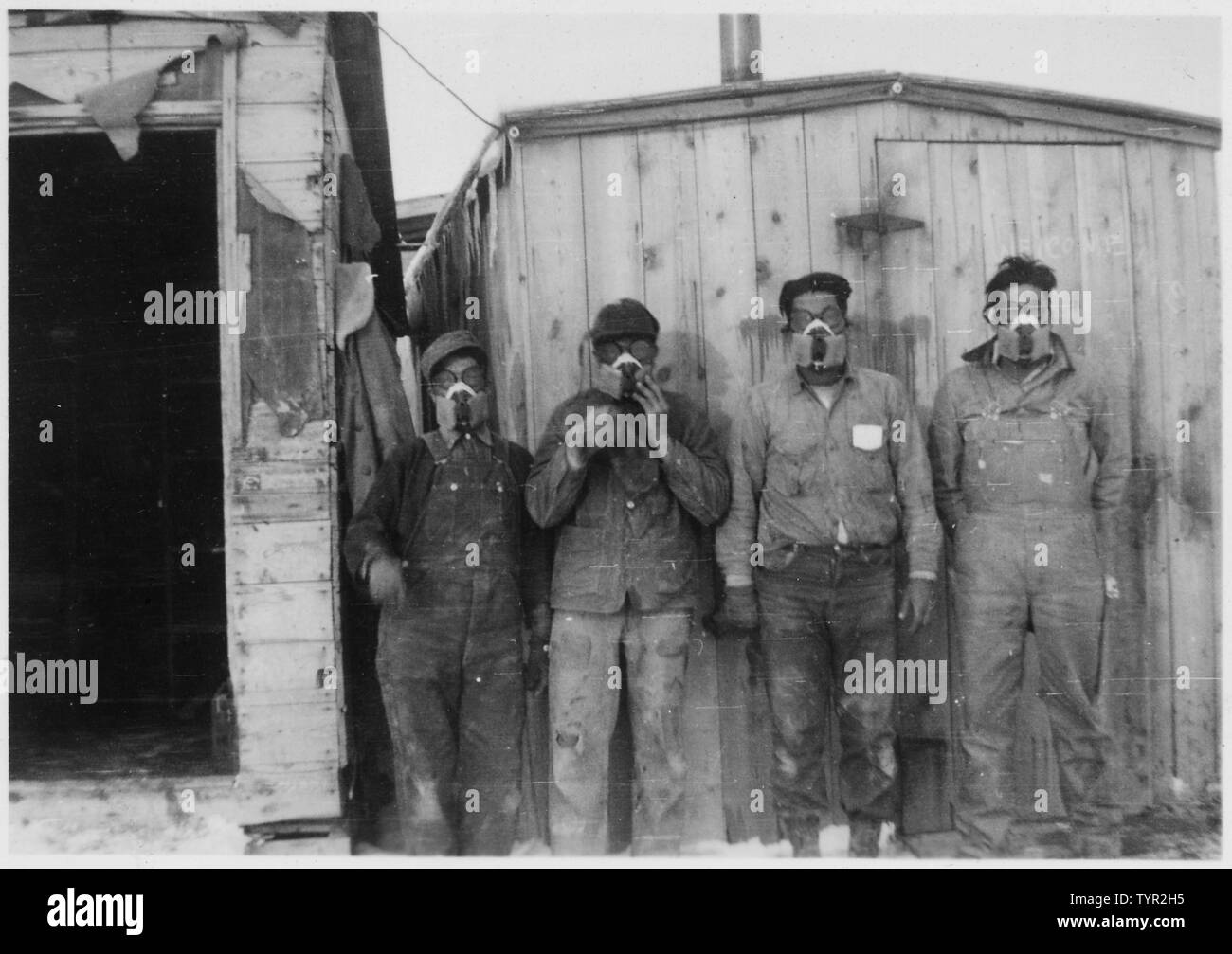 Workers from the Oglala Dam project wear face masks Stock Photo - Alamy