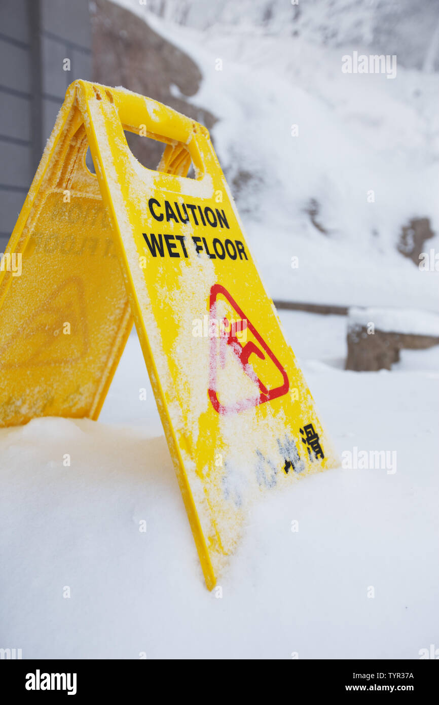 warning caution sign board on snow floor on hill Stock Photo - Alamy