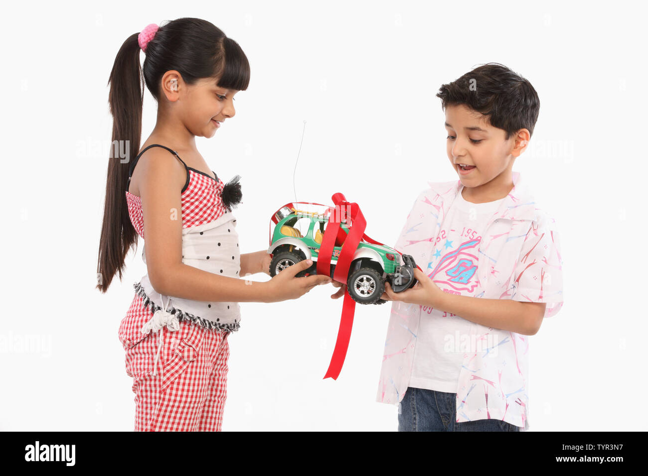 Girl giving gift to his friend Stock Photo - Alamy