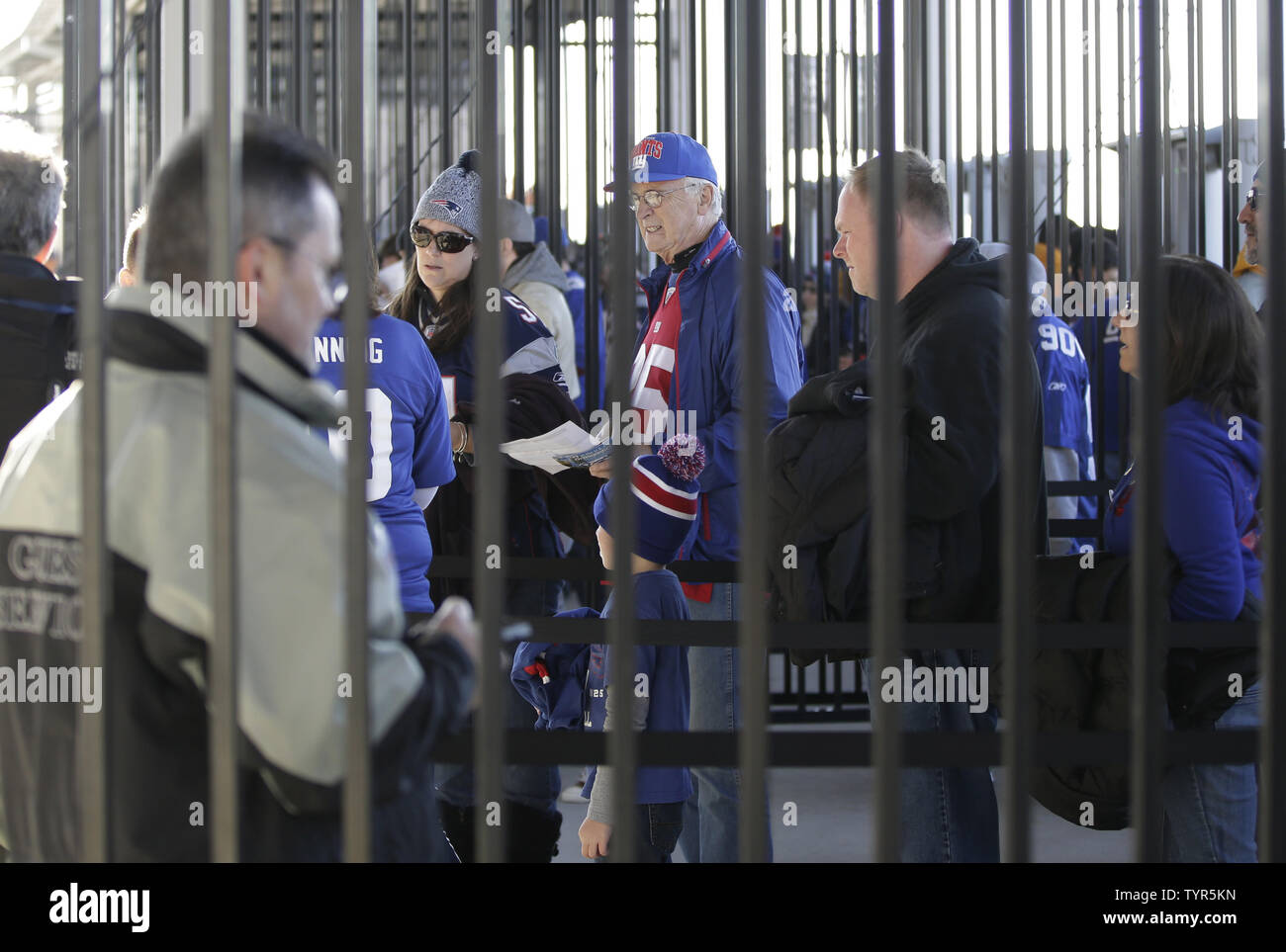 Fans go through a security checkpoint at the gates before the New York ...