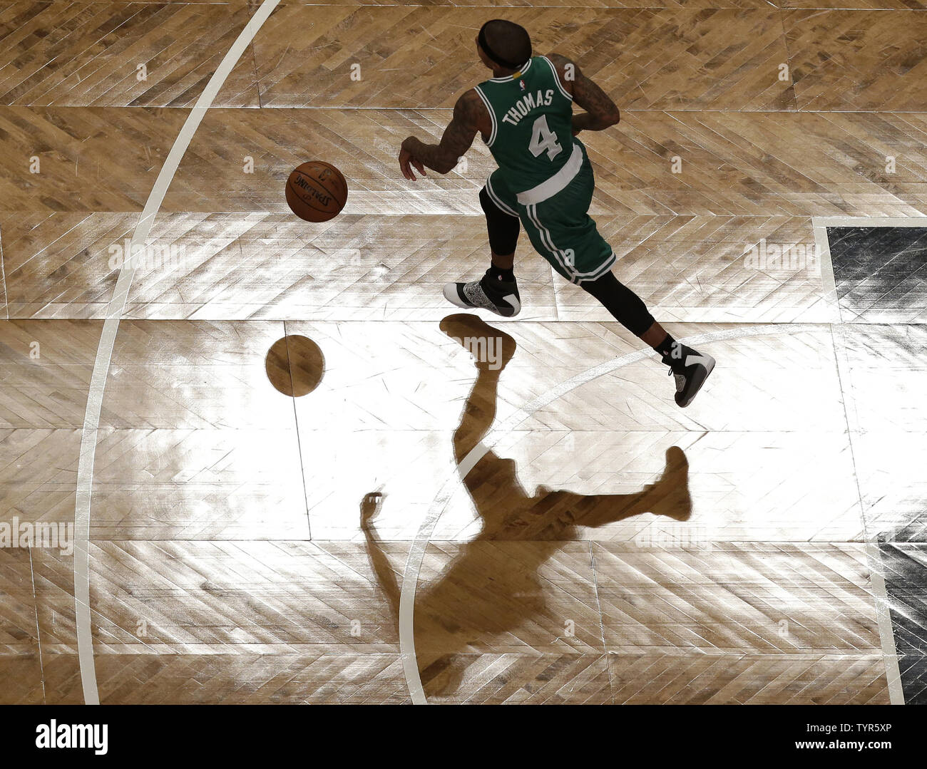 Boston Celtics Isaiah Thomas brings the ball up the court in the first ...