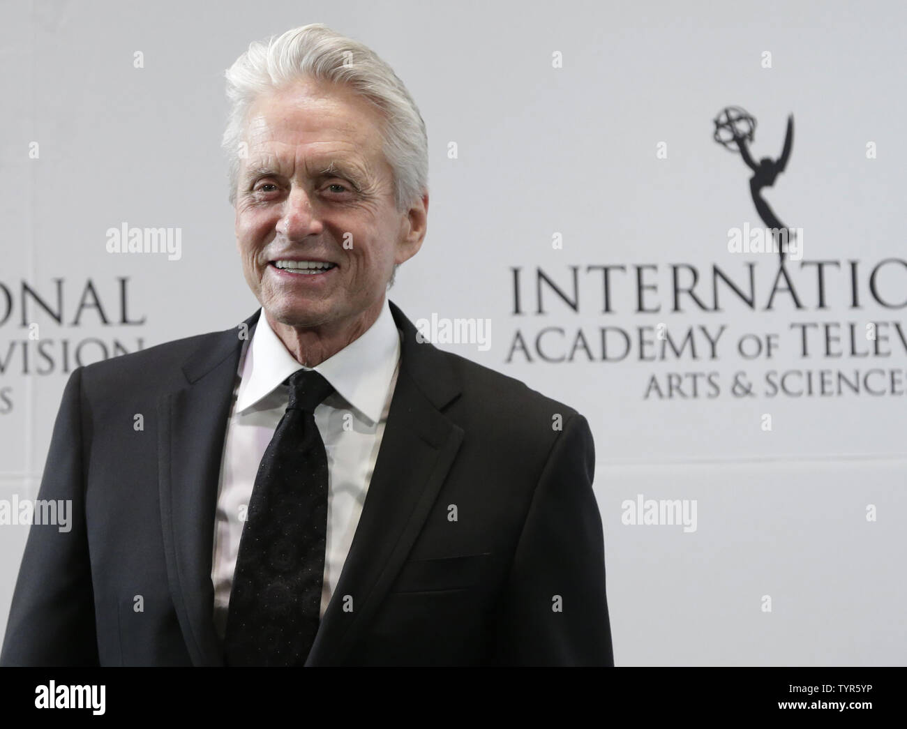 Presenter Michael Douglas stands on the stage in the pressroom at the ...