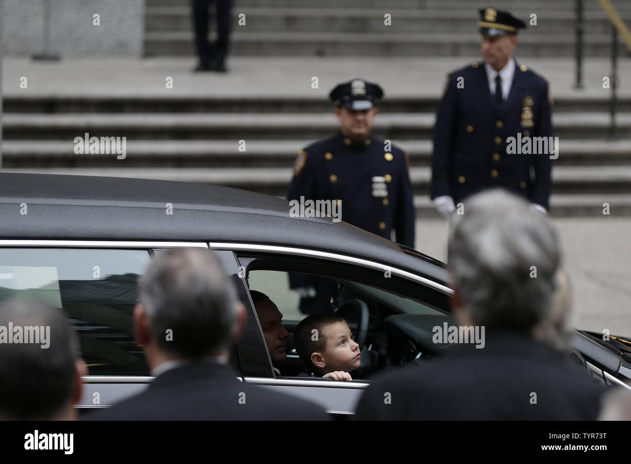 Detective Joseph Lemm's 4-year-old son arrives at the funeral for his ...