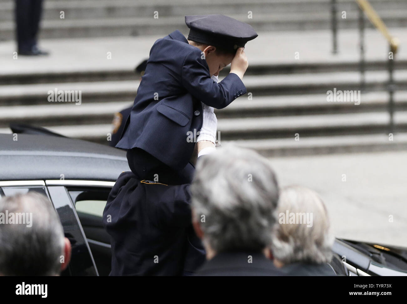 Detective Joseph Lemm's 4-year-old son arrives at the funeral for his ...