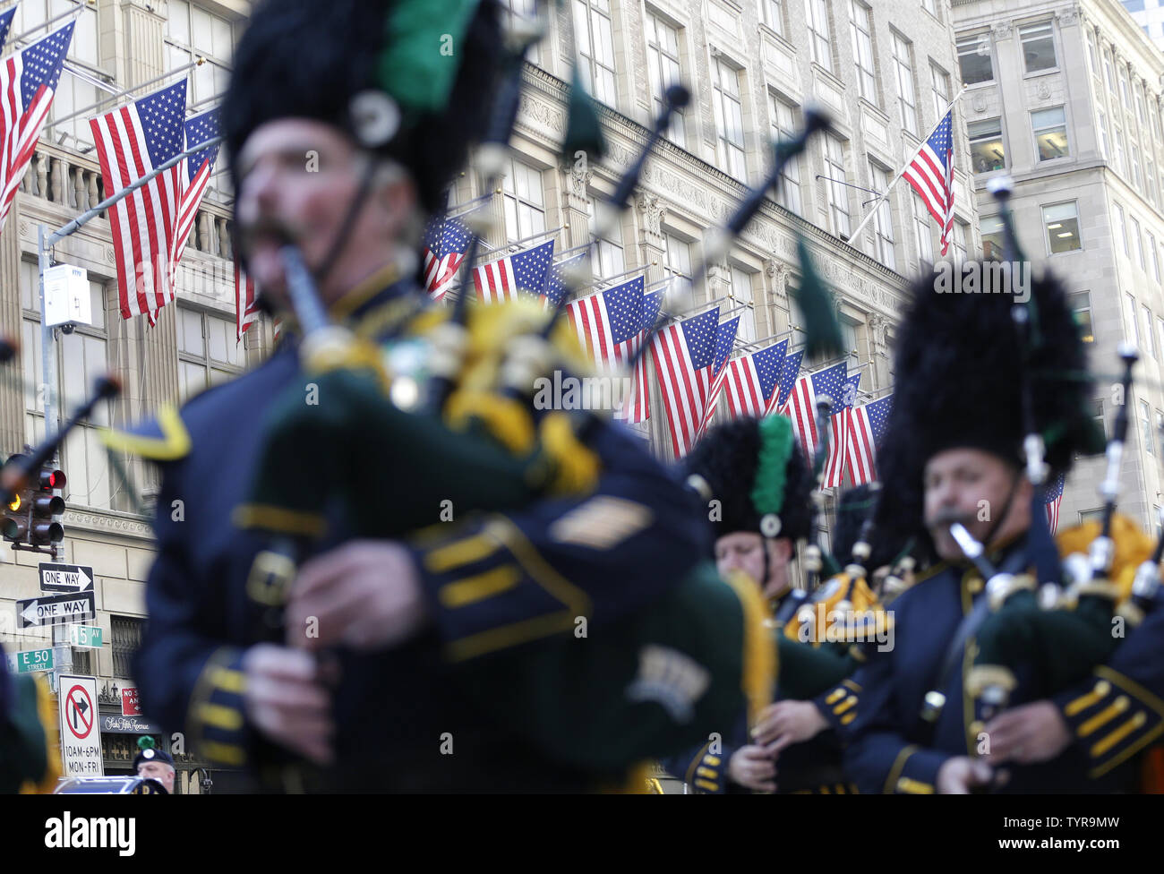 A marching band of Bagpipes march on the parade route at the St ...