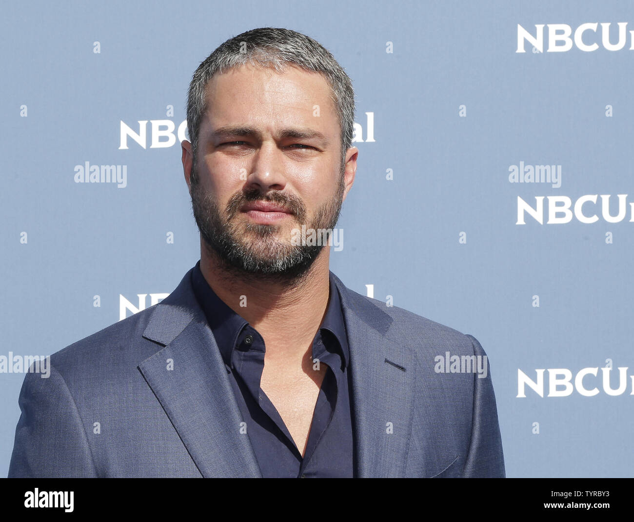 Taylor Kinney arrives on the carpet the 2016 NBCUNIVERSAL Upfront at ...