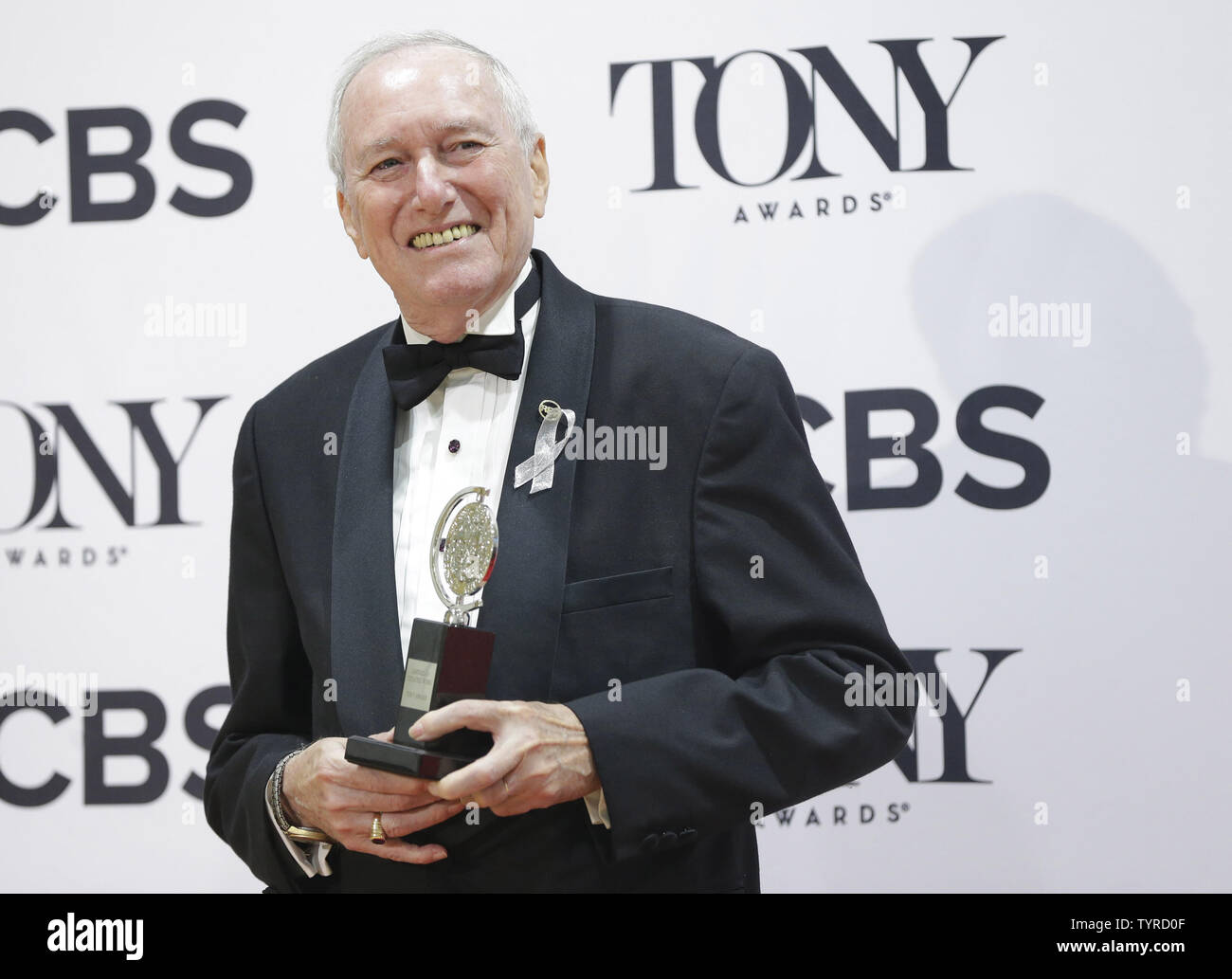 Marshall W. Mason arrives in the press room after winning a Tony Award ...