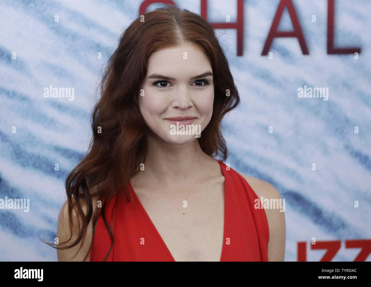 Emily Tyra arrives on the red carpet at The Shallows World Premiere at ...