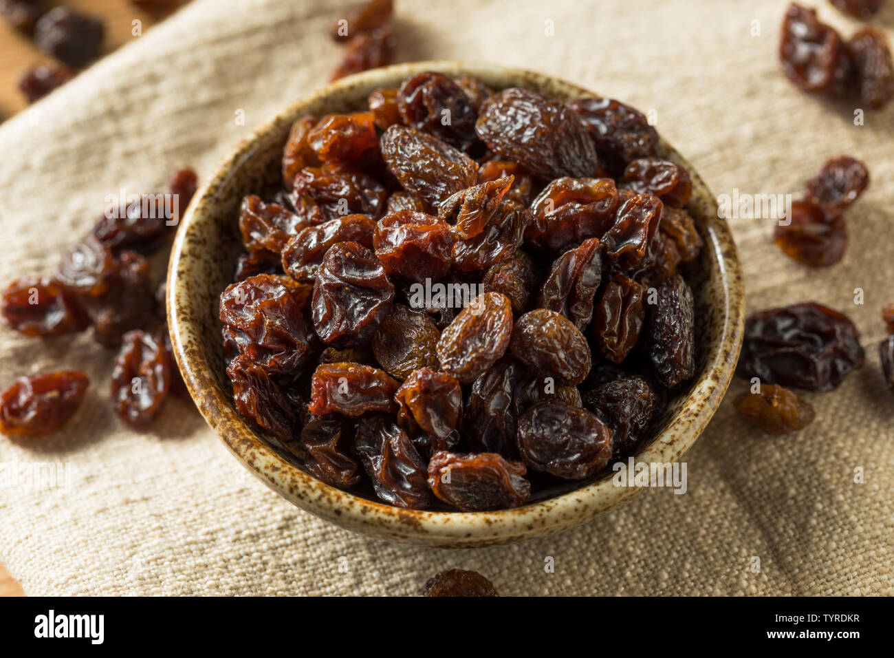 Organic Dried Brown Raisins in a Bowl Stock Photo - Alamy