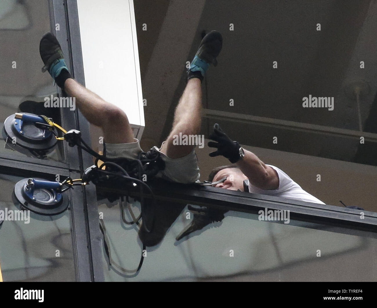 Man climbing out of window hi-res stock photography and images - Alamy