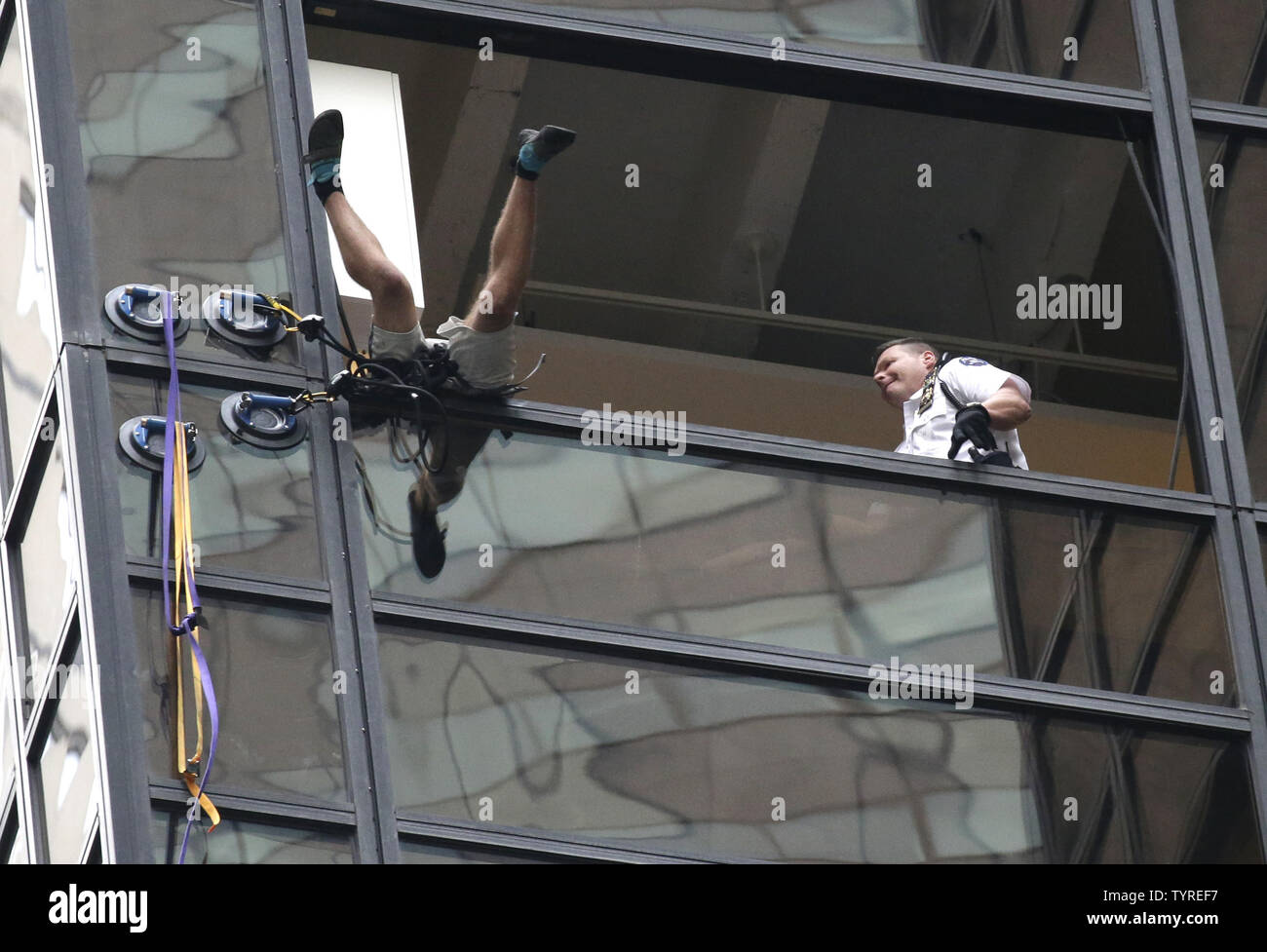 Man climbing out of window hi-res stock photography and images - Alamy