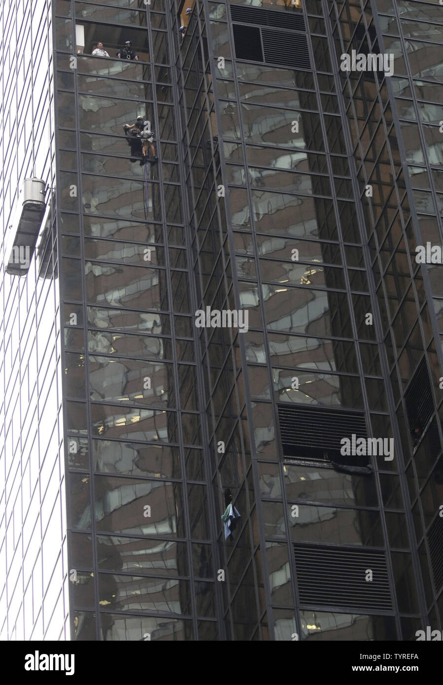 Man climbing out of window hi-res stock photography and images - Alamy