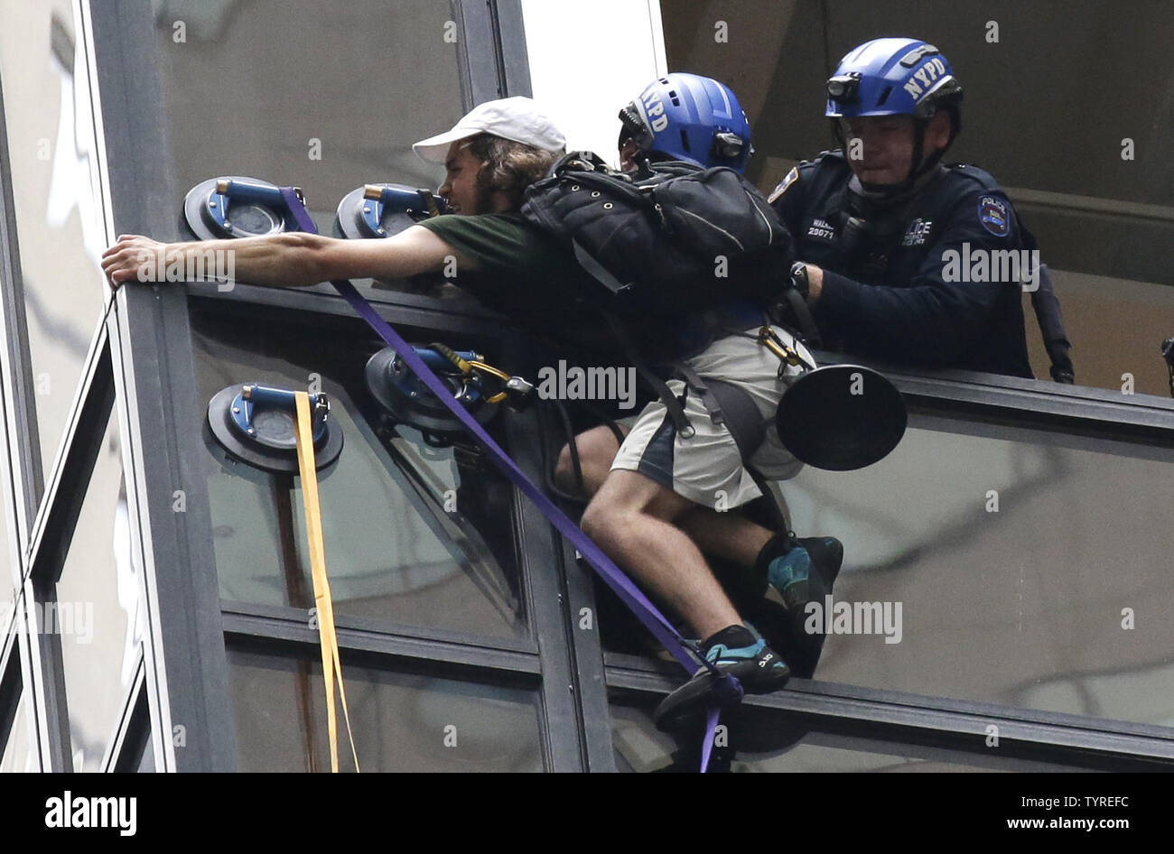 Man climbing out of window hi-res stock photography and images - Alamy
