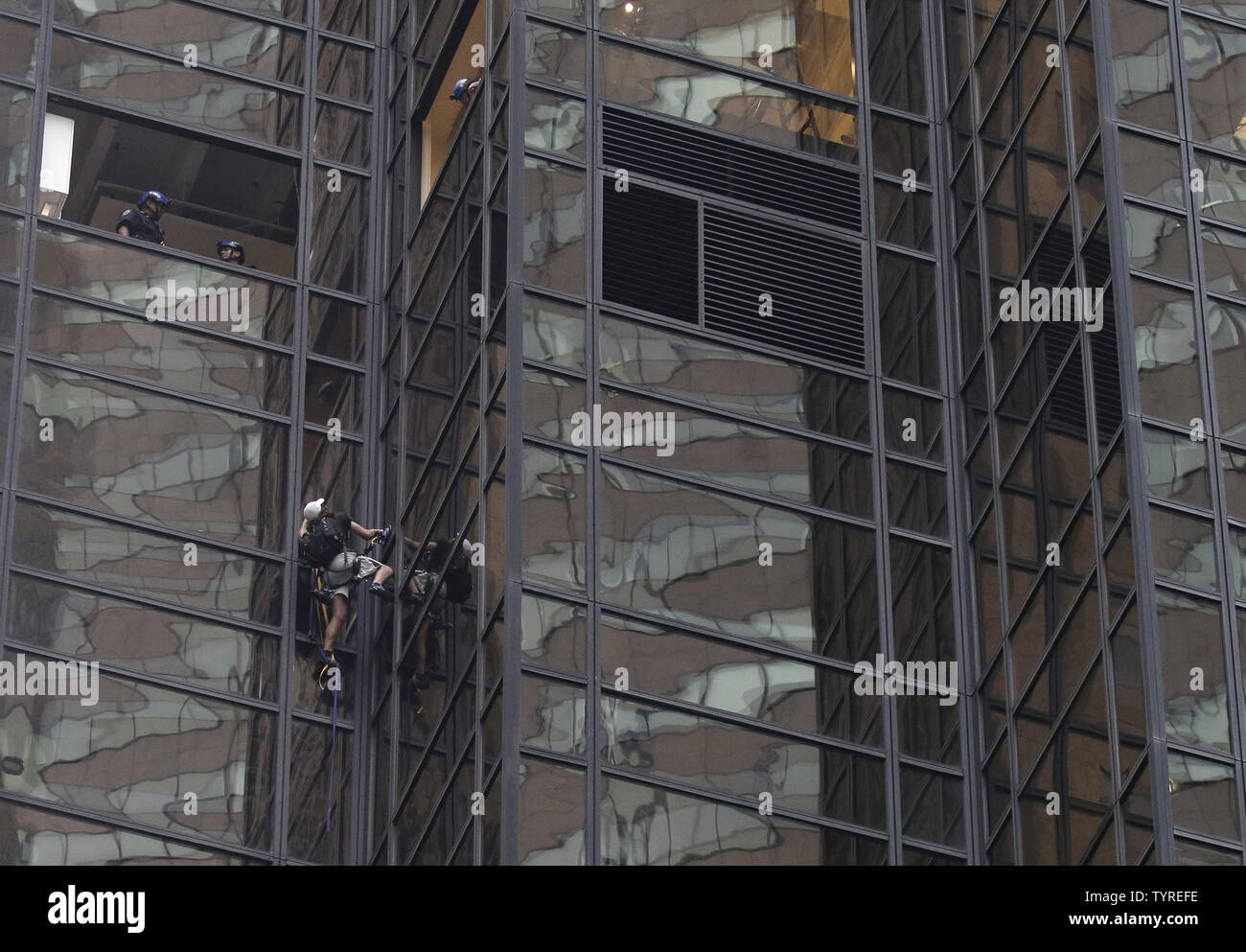 Man climbing out of window hi-res stock photography and images - Alamy