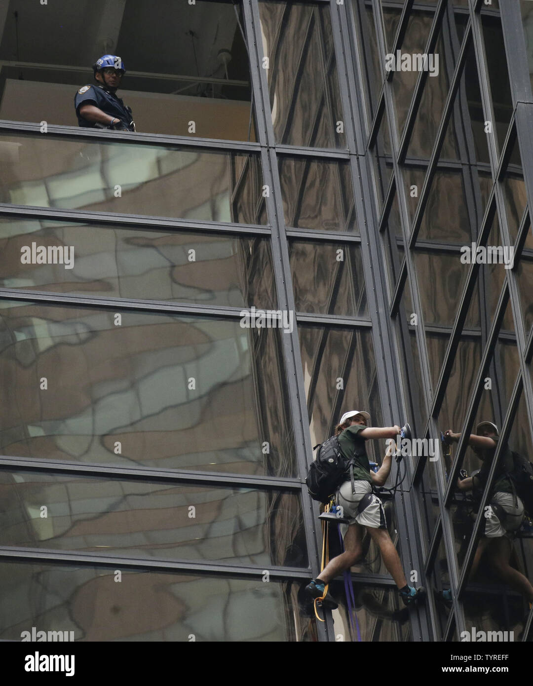 Man climbing out of window hi-res stock photography and images - Alamy
