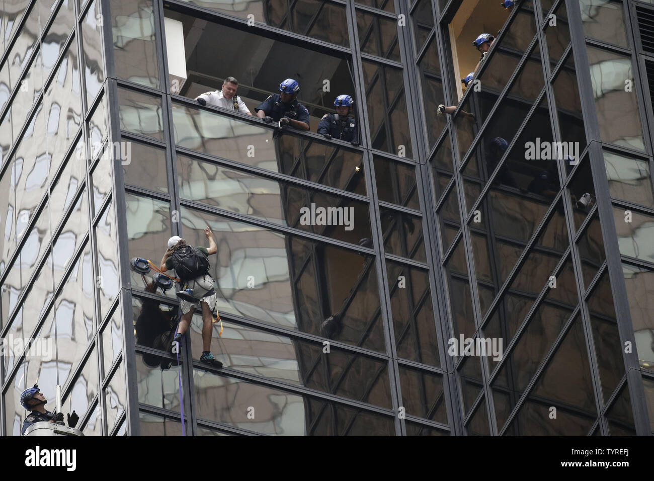 Man climbing out of window hi-res stock photography and images - Alamy