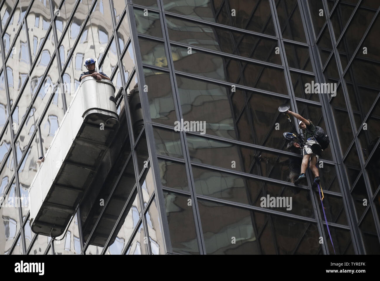 Man climbing out of window hi-res stock photography and images - Alamy