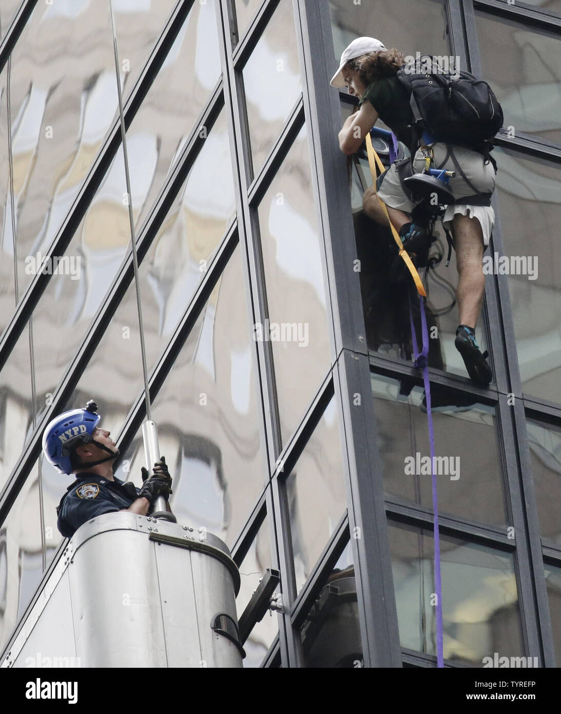 Man climbing out of window hi-res stock photography and images - Alamy