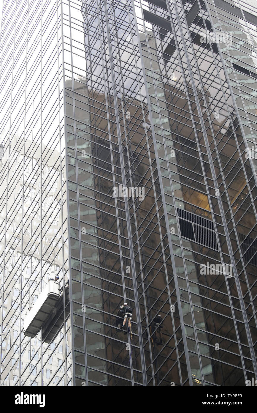 Man climbing out of window hi-res stock photography and images - Alamy
