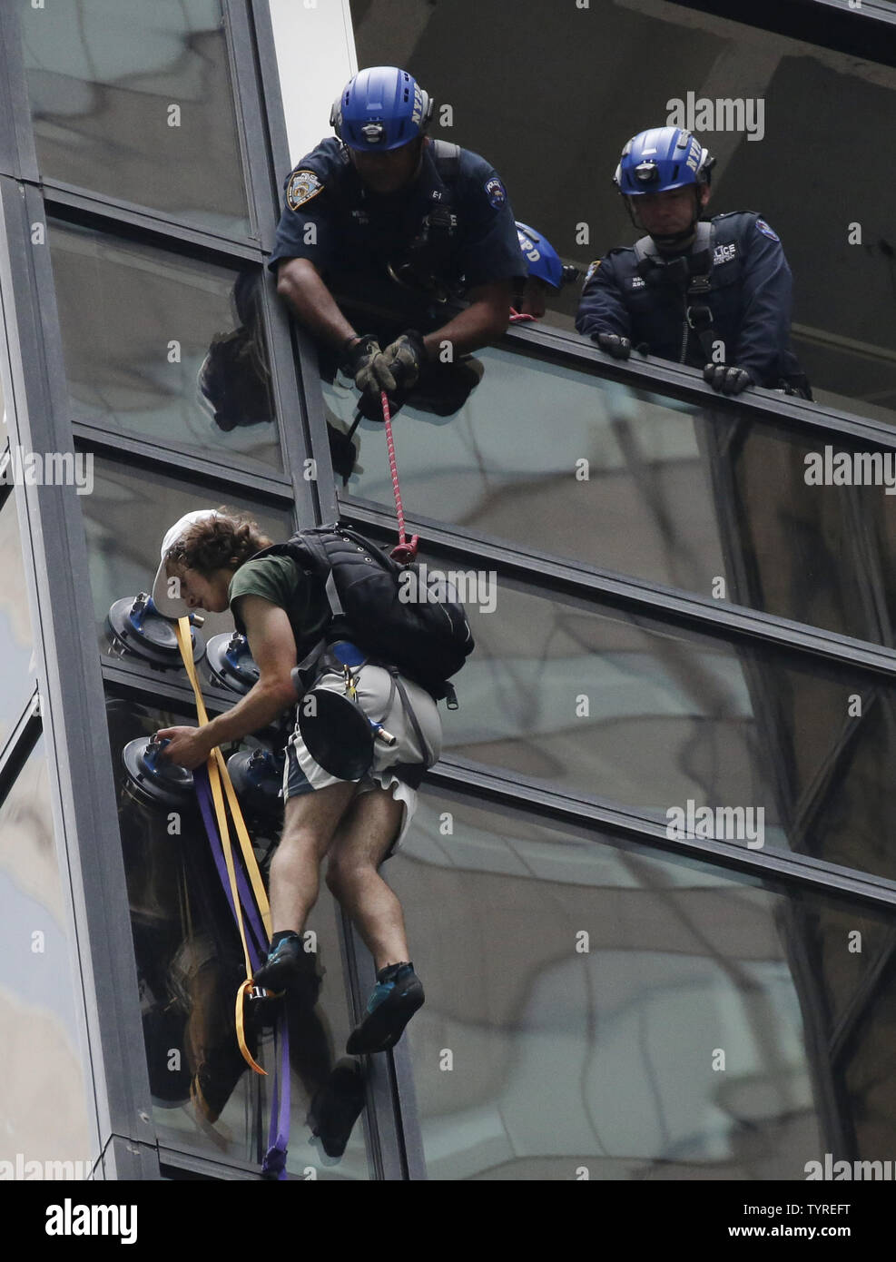 Man climbing out of window hi-res stock photography and images - Alamy