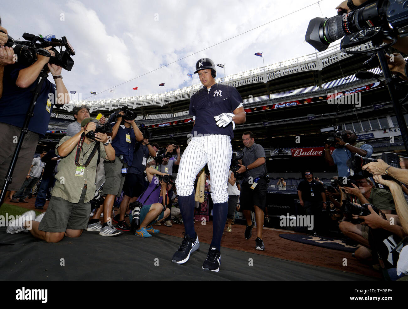 New York Yankees Alex Rodriguez walks out to the field through cameras ...