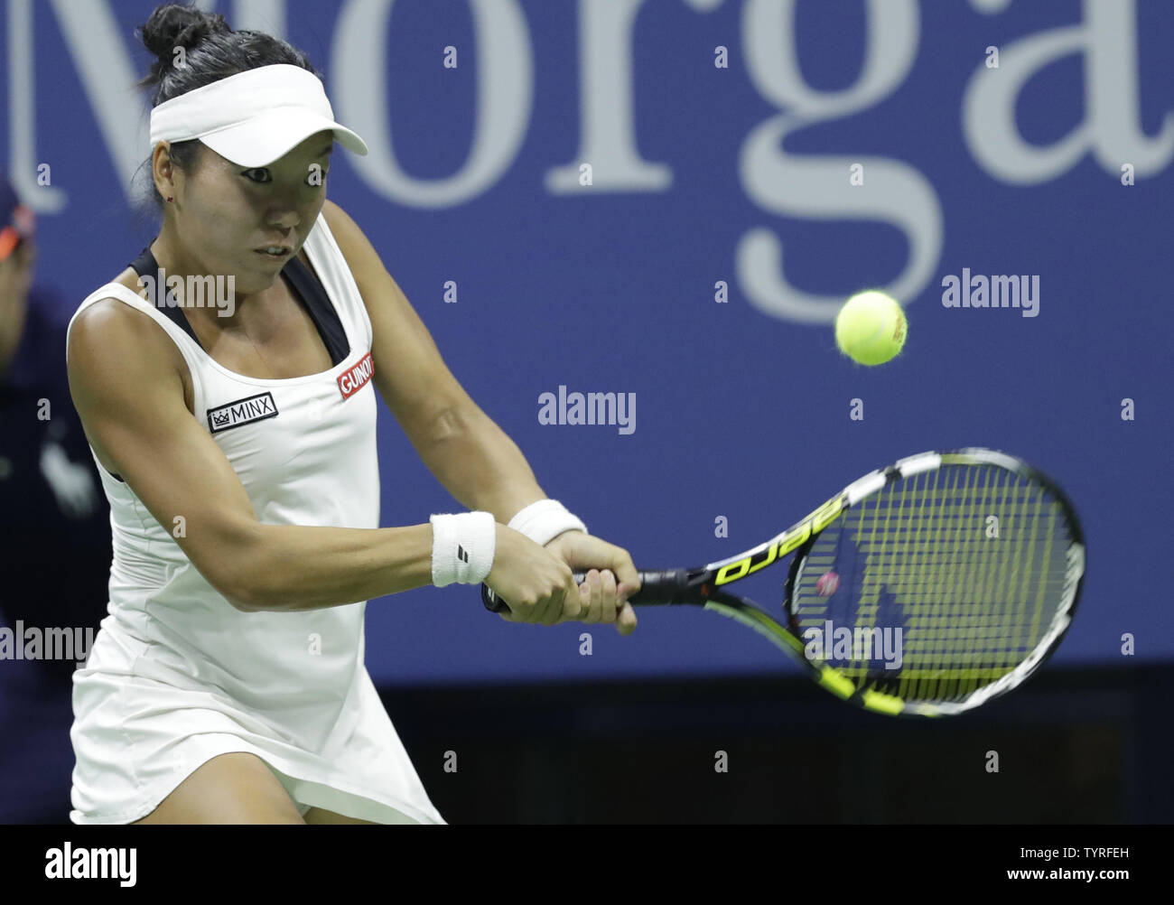 Vania King of the United States hits a backhand to Serena Williams of ...
