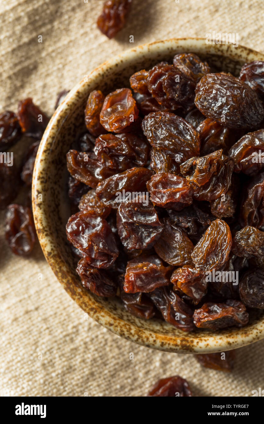 Organic Dried Brown Raisins in a Bowl Stock Photo - Alamy