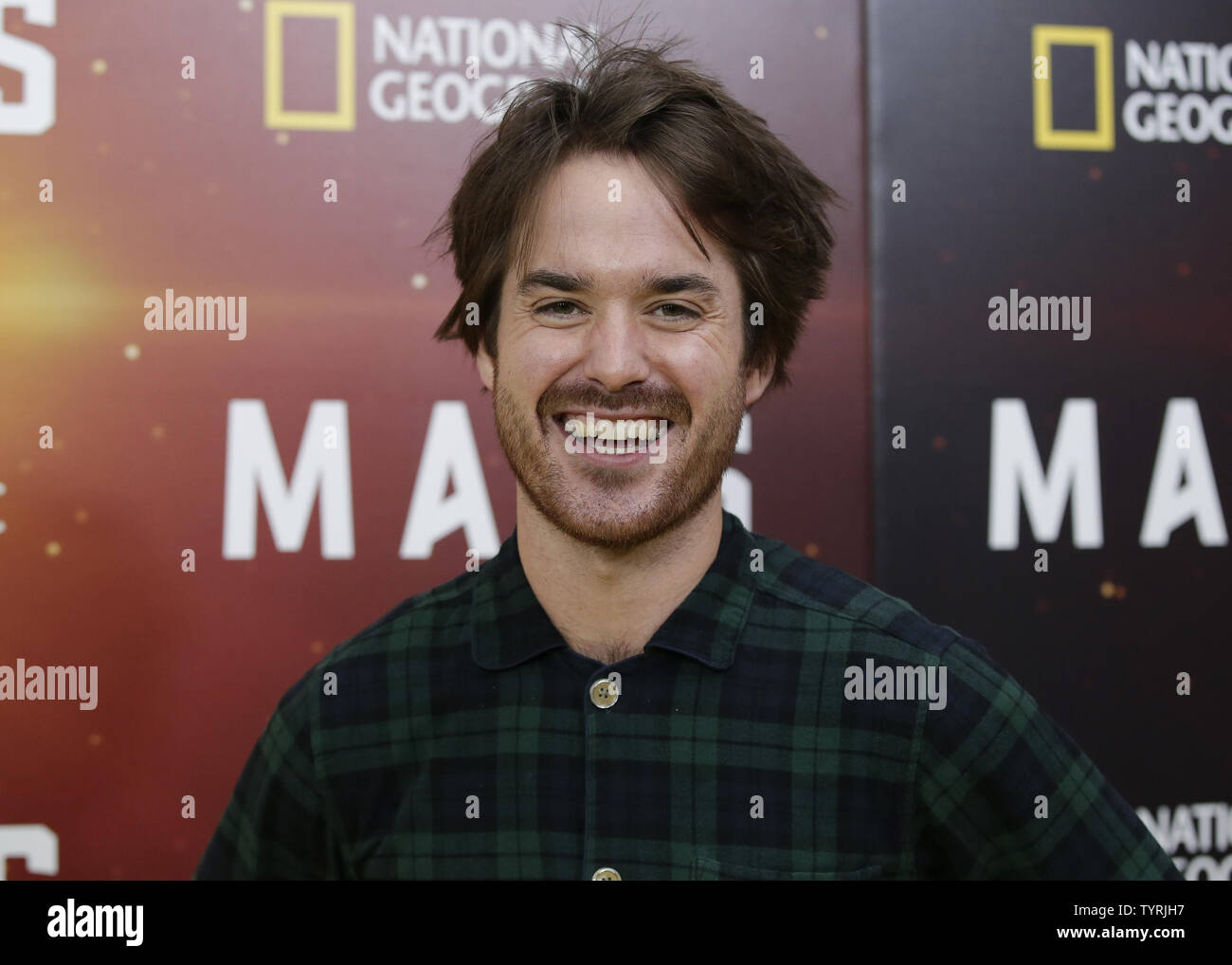 Thomas Matthews arrives on the red carpet at the National Geographic ...