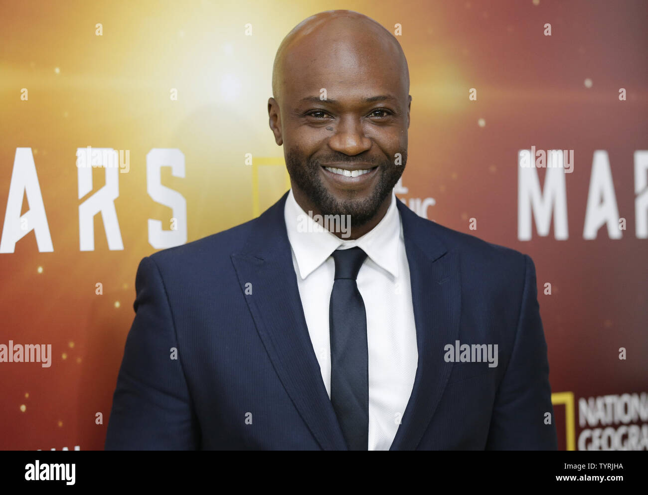 Sammi Rotibi arrives on the red carpet at the National Geographic ...