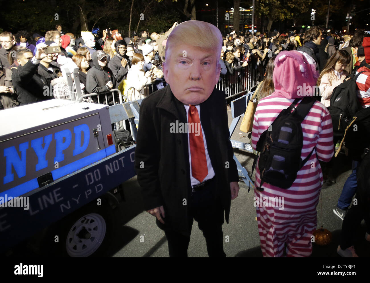 A man dressed as Republican Nominee for President Donald Trump marches ...
