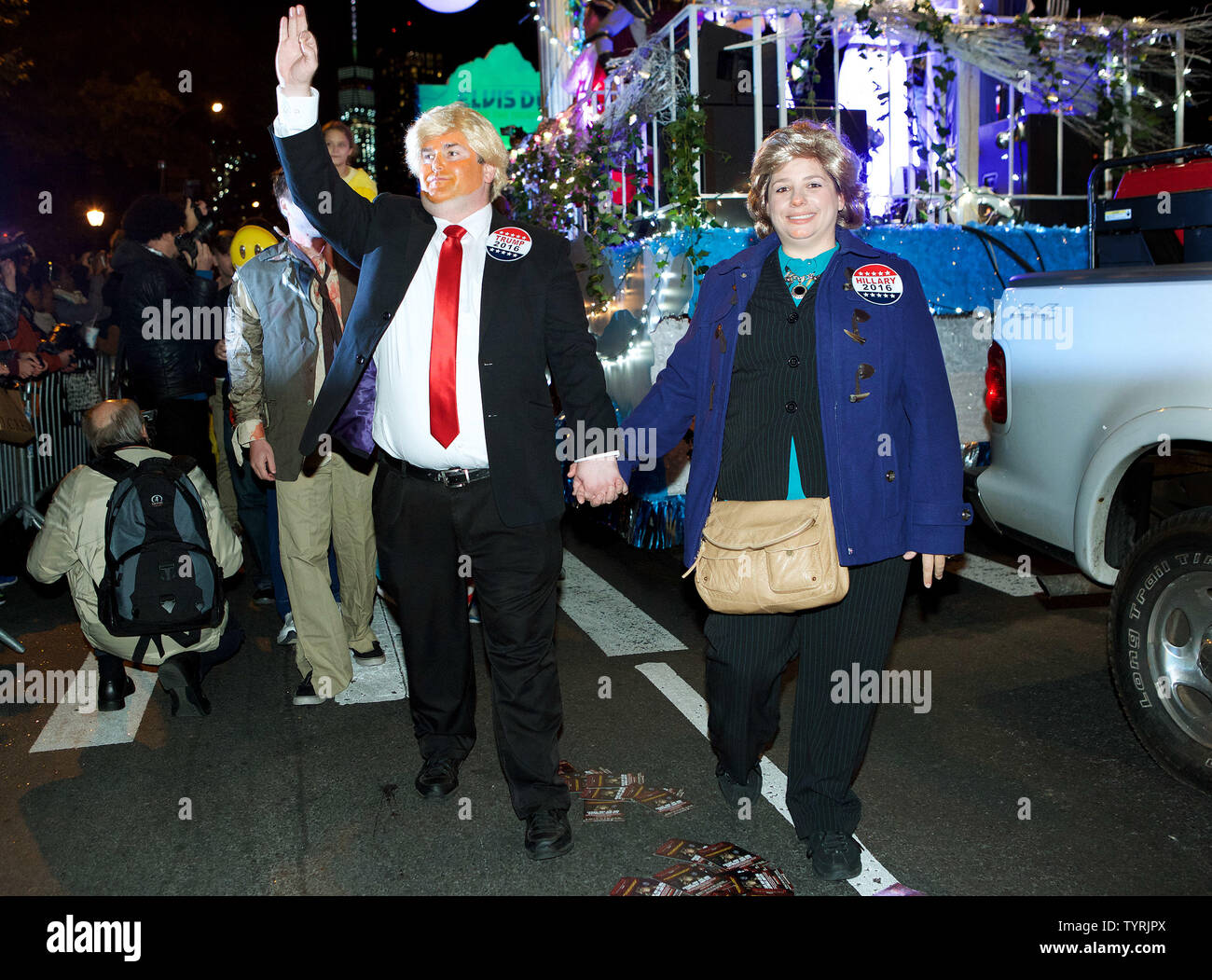 A couple dressed as presidential candidates Donald Trump and Hillary ...