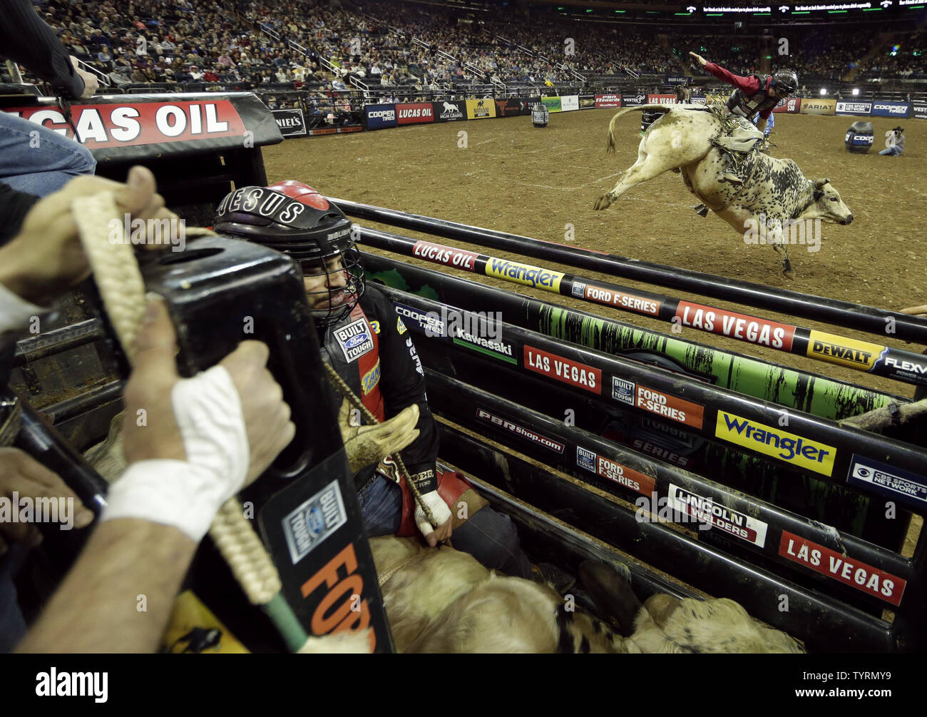A rider falls off of the back of a bull when he competes at the ...