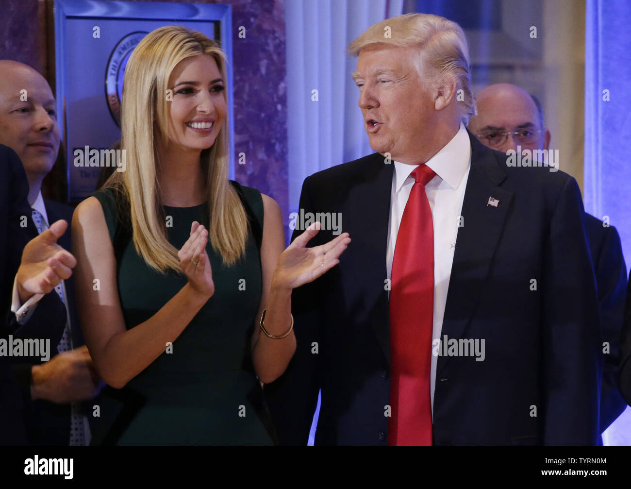 U.S. President-elect Donald Trump smiles with Ivanka Trump before he ...