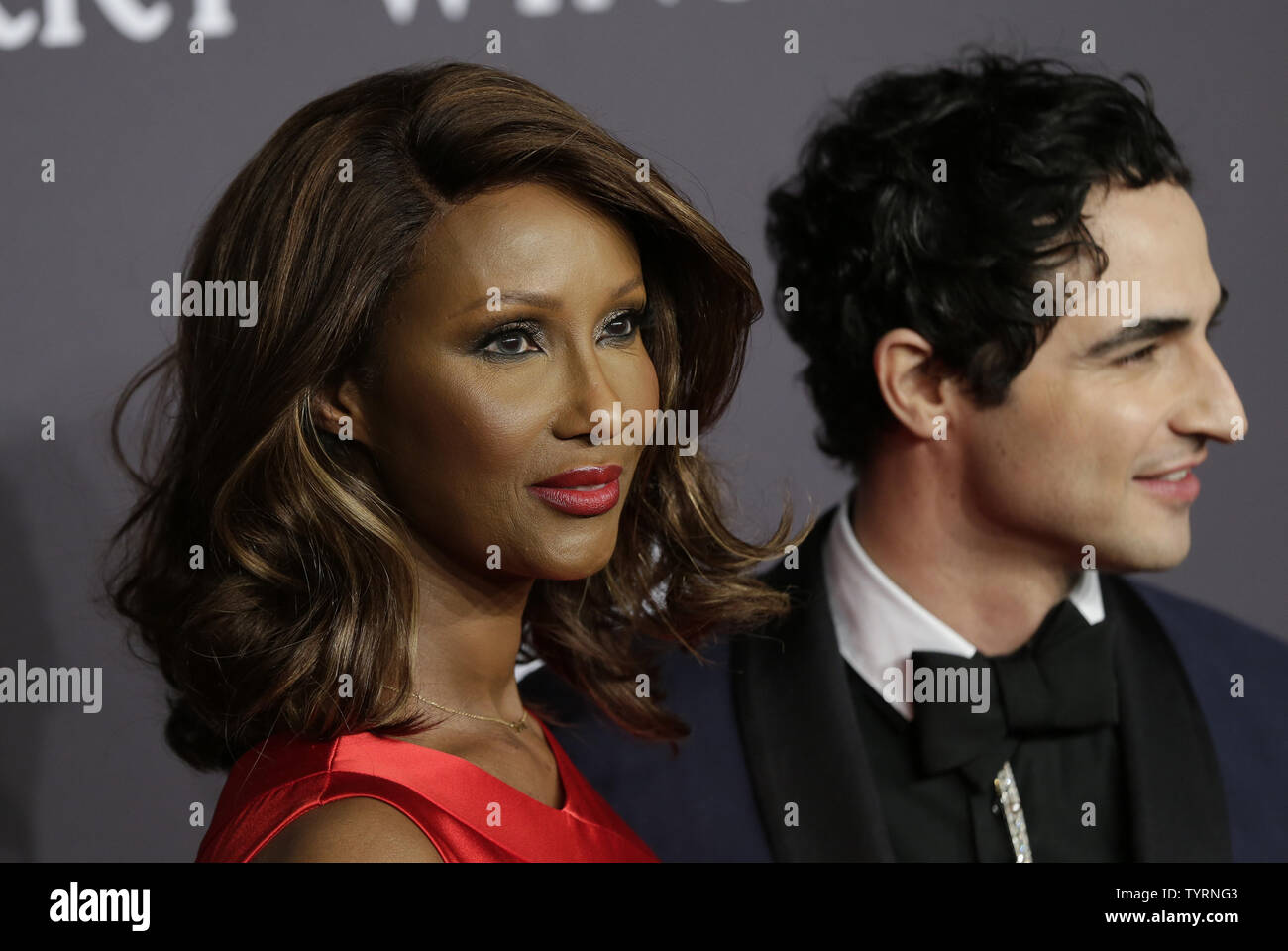 Iman and Zac Posen arrive on the red carpet at the 19th annual amfAR ...