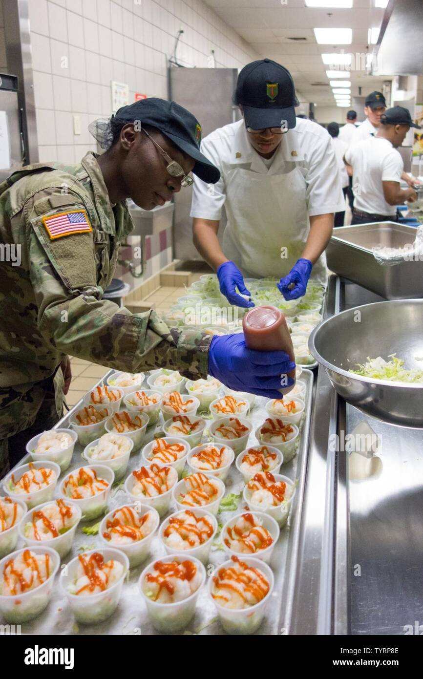 Culinary specialists with 1st Infantry Division prepare seafood salad ...