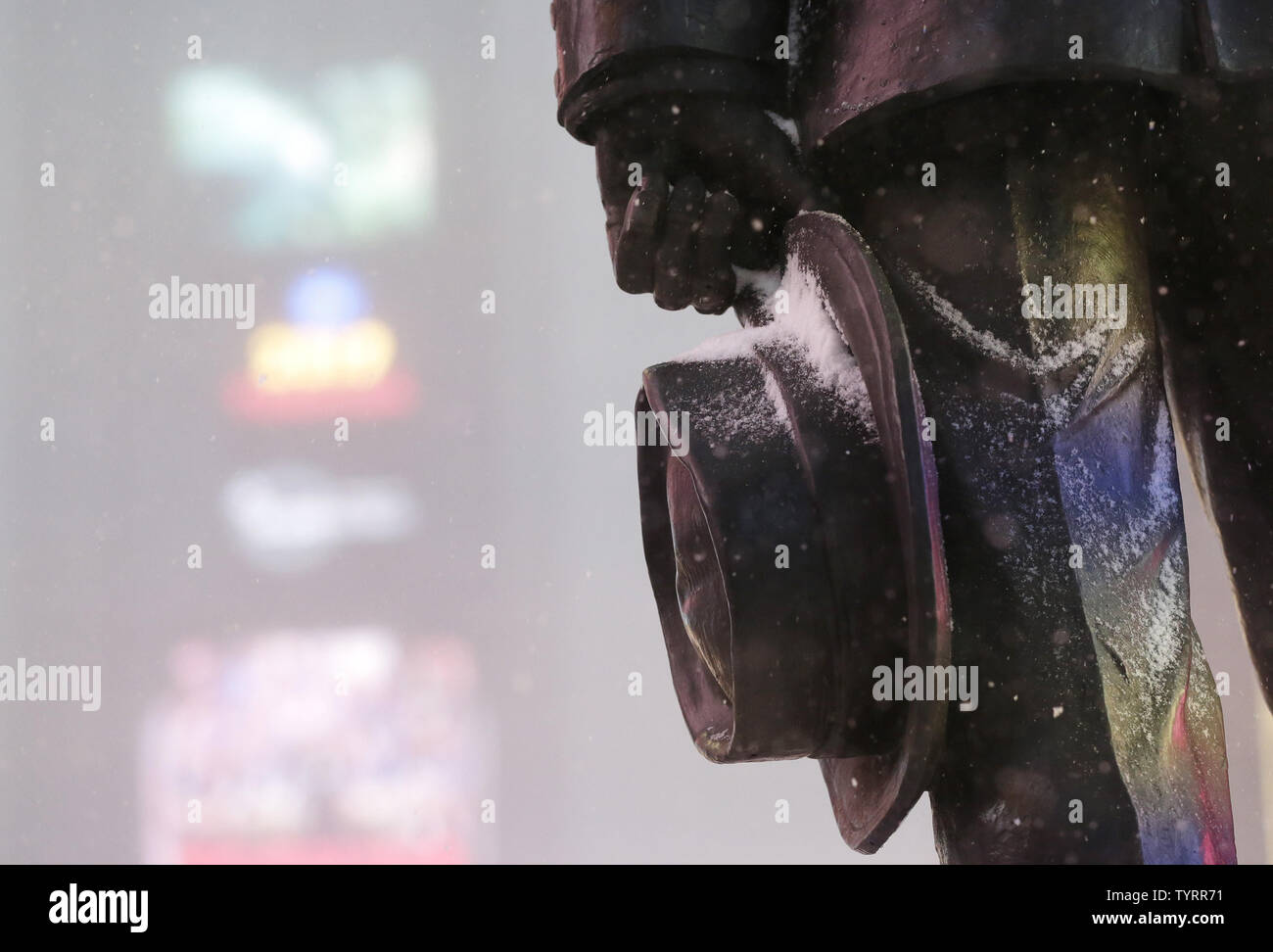 Snow sticks to the hat of the George M. Cohan statue in Times Square in ...